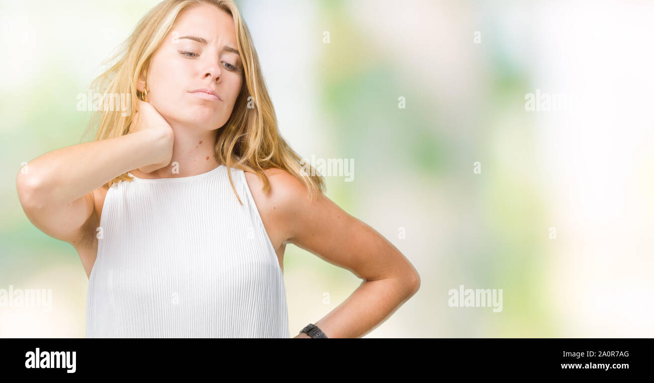 Beautiful young elegant woman over isolated background Suffering of ...