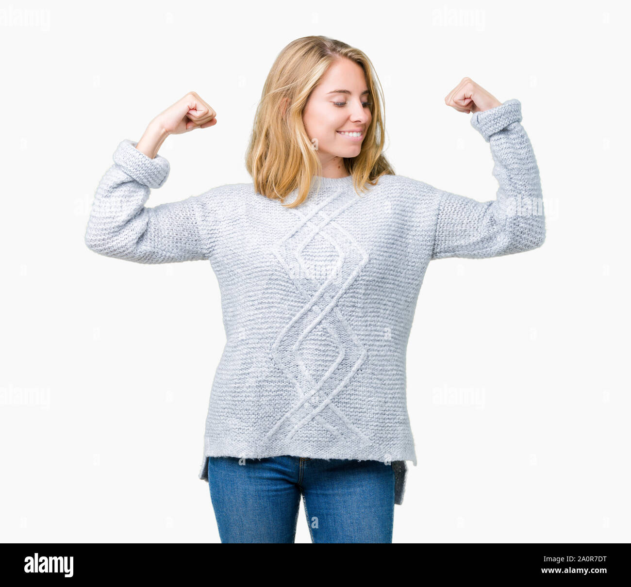 Beautiful young woman wearing winter sweater over isolated background ...