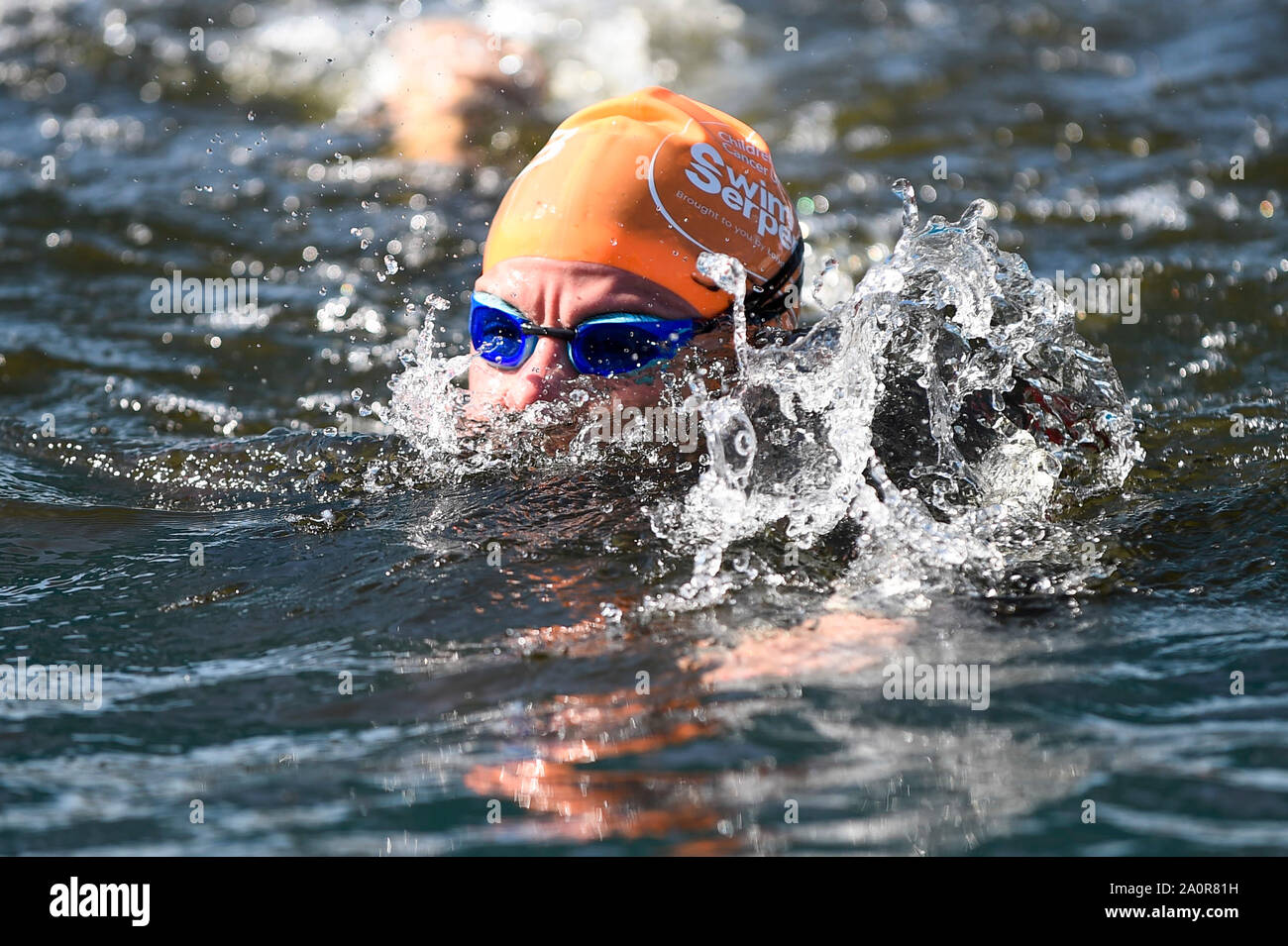London, UK. 21 September 2019. A swimmer finishes as 6,000 participants ...