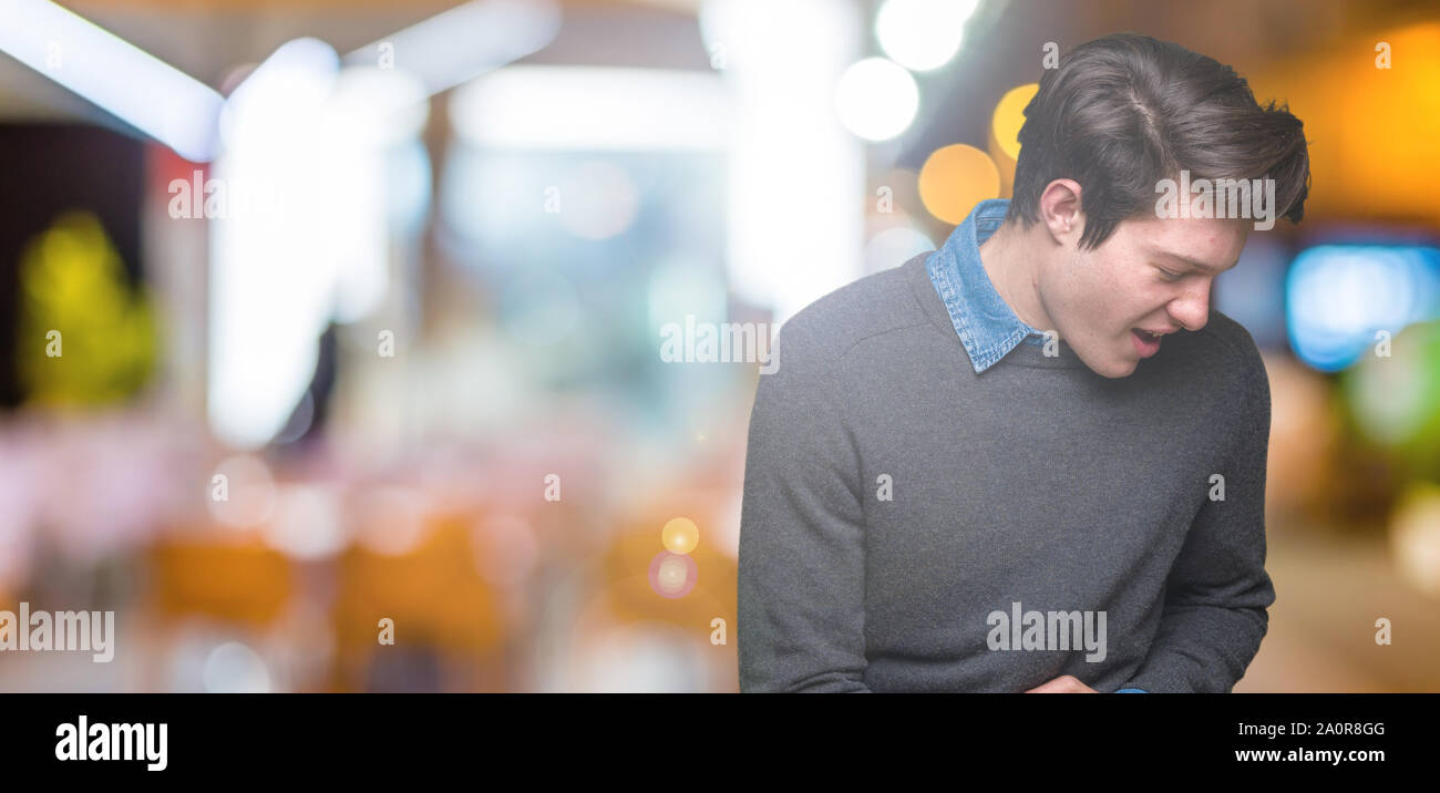 Young handsome elegant man over isolated background with hand on ...