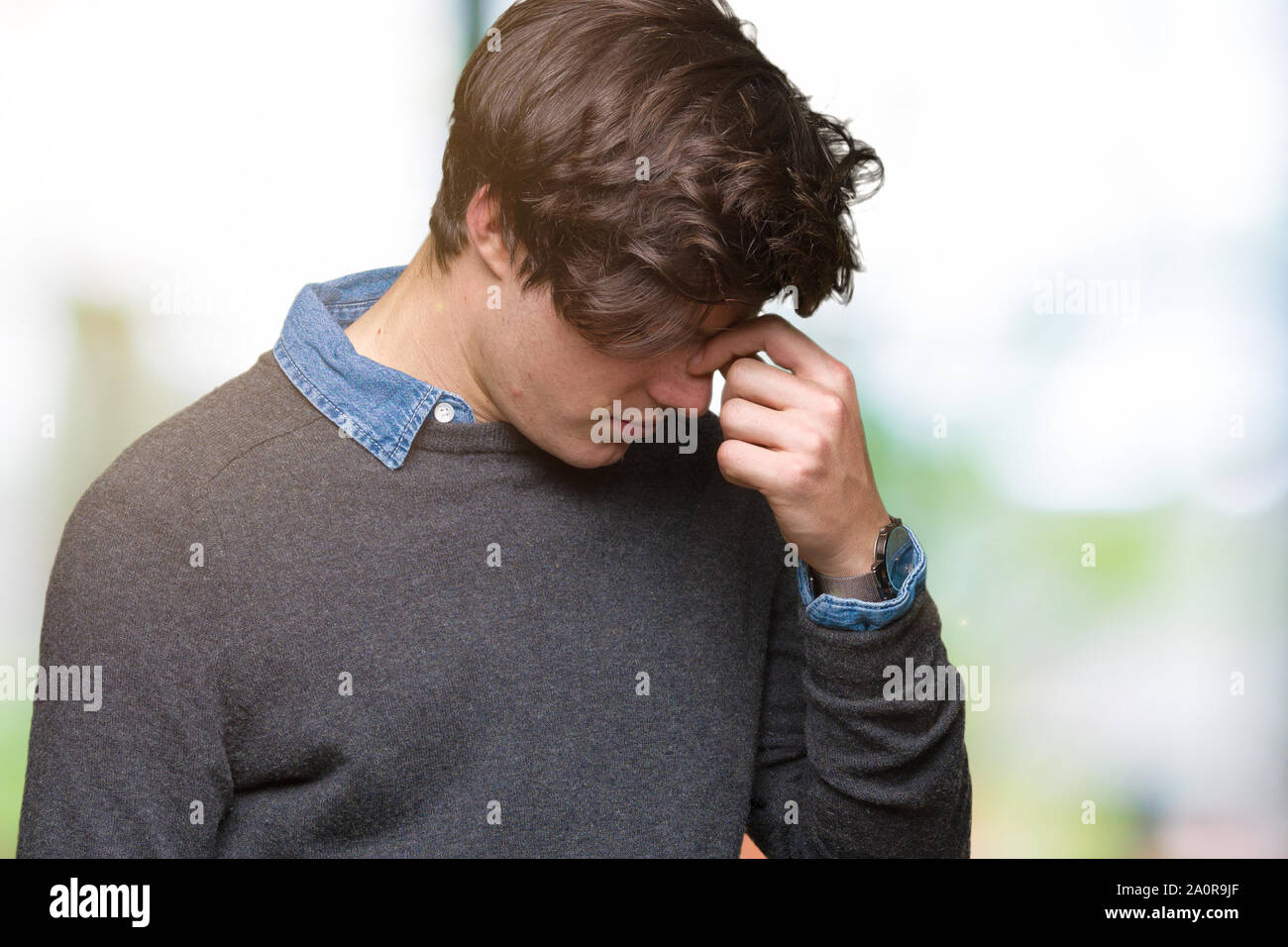 Young handsome elegant man over isolated background tired rubbing nose ...