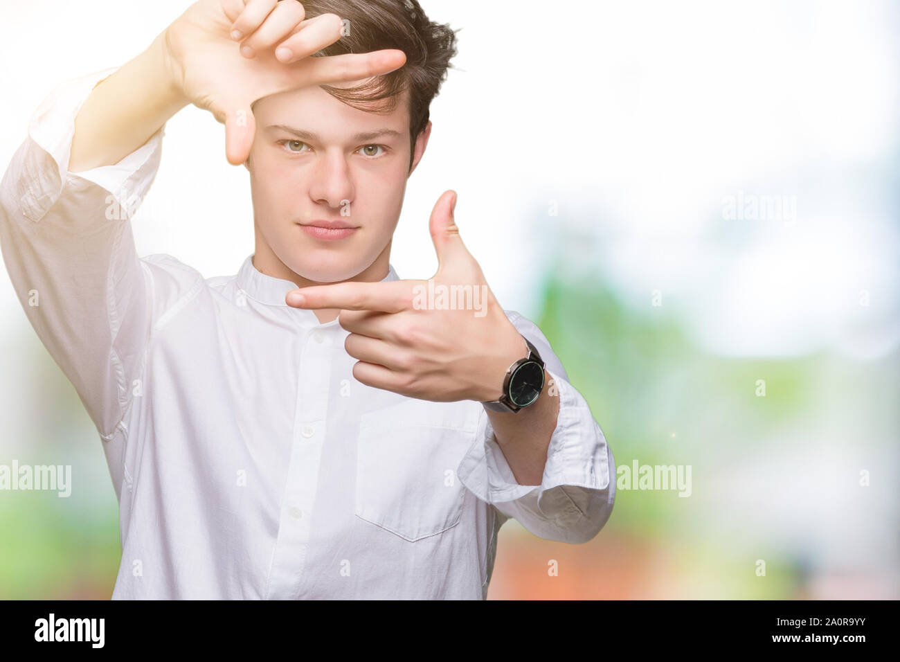 Young handsome business man over isolated background smiling making ...