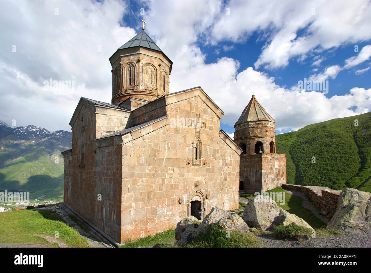 Gergeti Trinity Church, Tsminda Sameba on blue sky with clouds ...