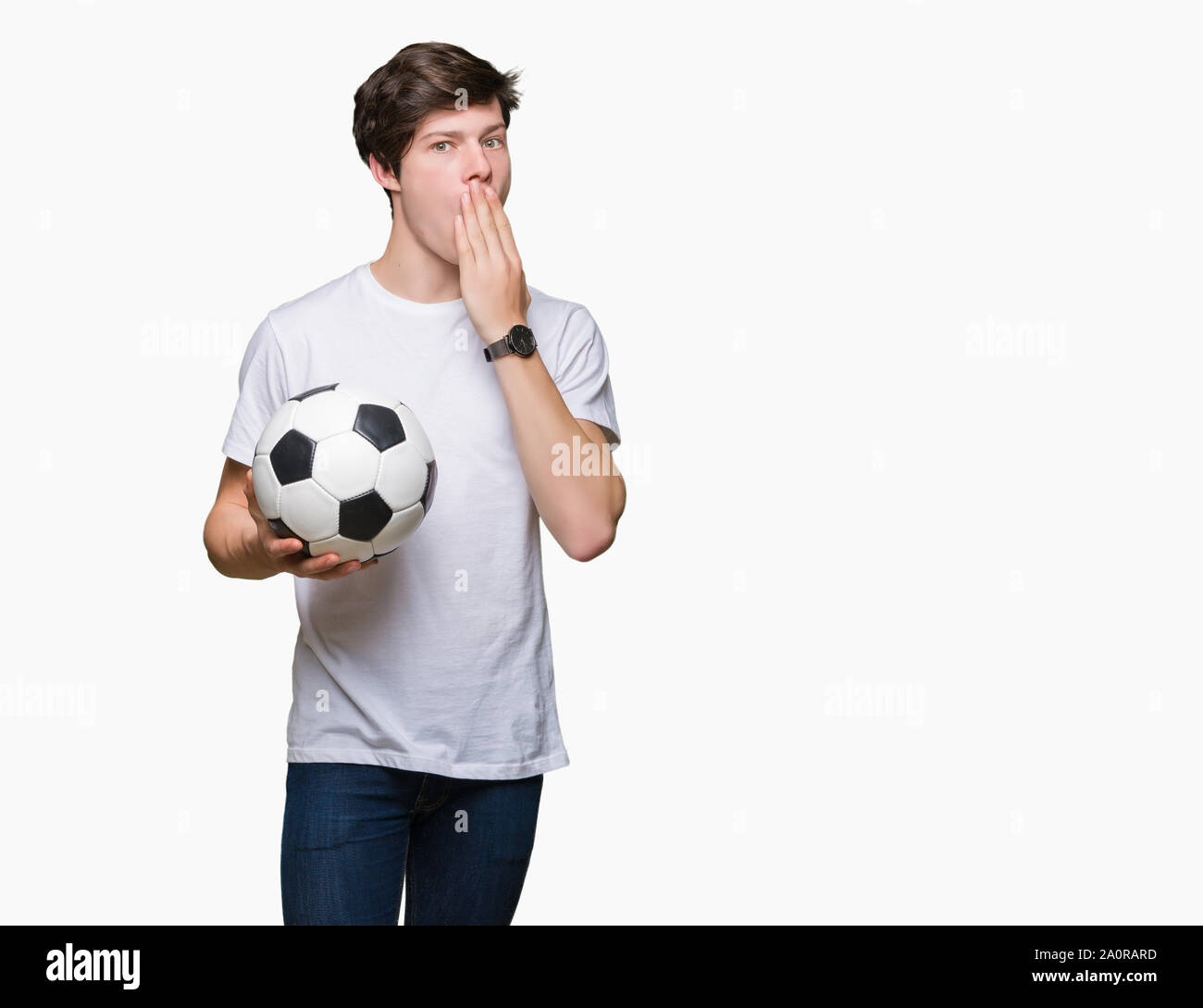Young man holding soccer football ball over isolated background cover ...