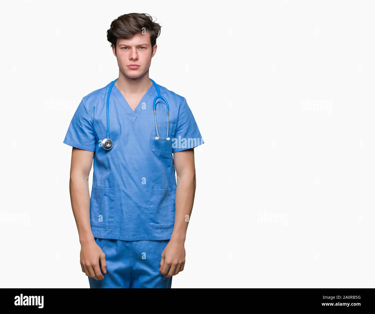 Young doctor wearing medical uniform over isolated background skeptic ...
