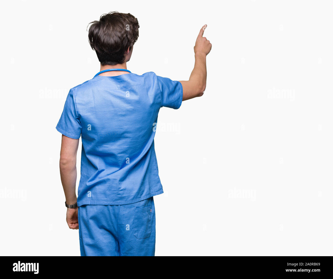 Young doctor wearing medical uniform over isolated background Posing ...