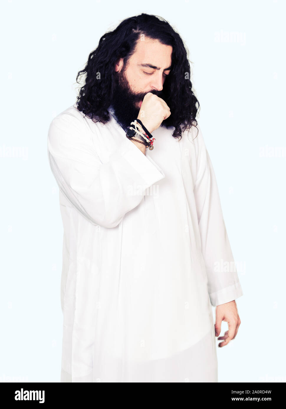 Man wearing Jesus Christ costume feeling unwell and coughing as symptom ...