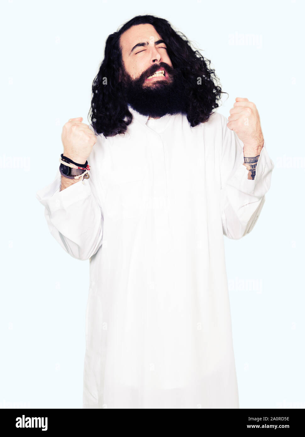 Man wearing Jesus Christ costume very happy and excited doing winner ...