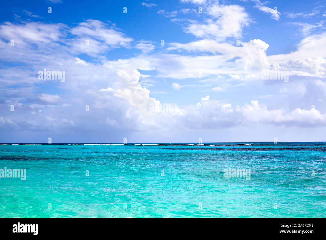 Blue sea, horizon line, blue sky with clouds background Stock Photo - Alamy