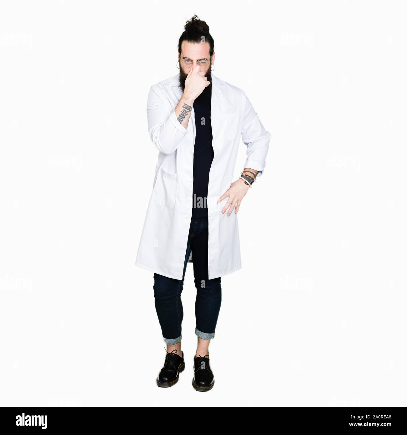 Doctor therapist man with long hair and bear wearing white coat ...