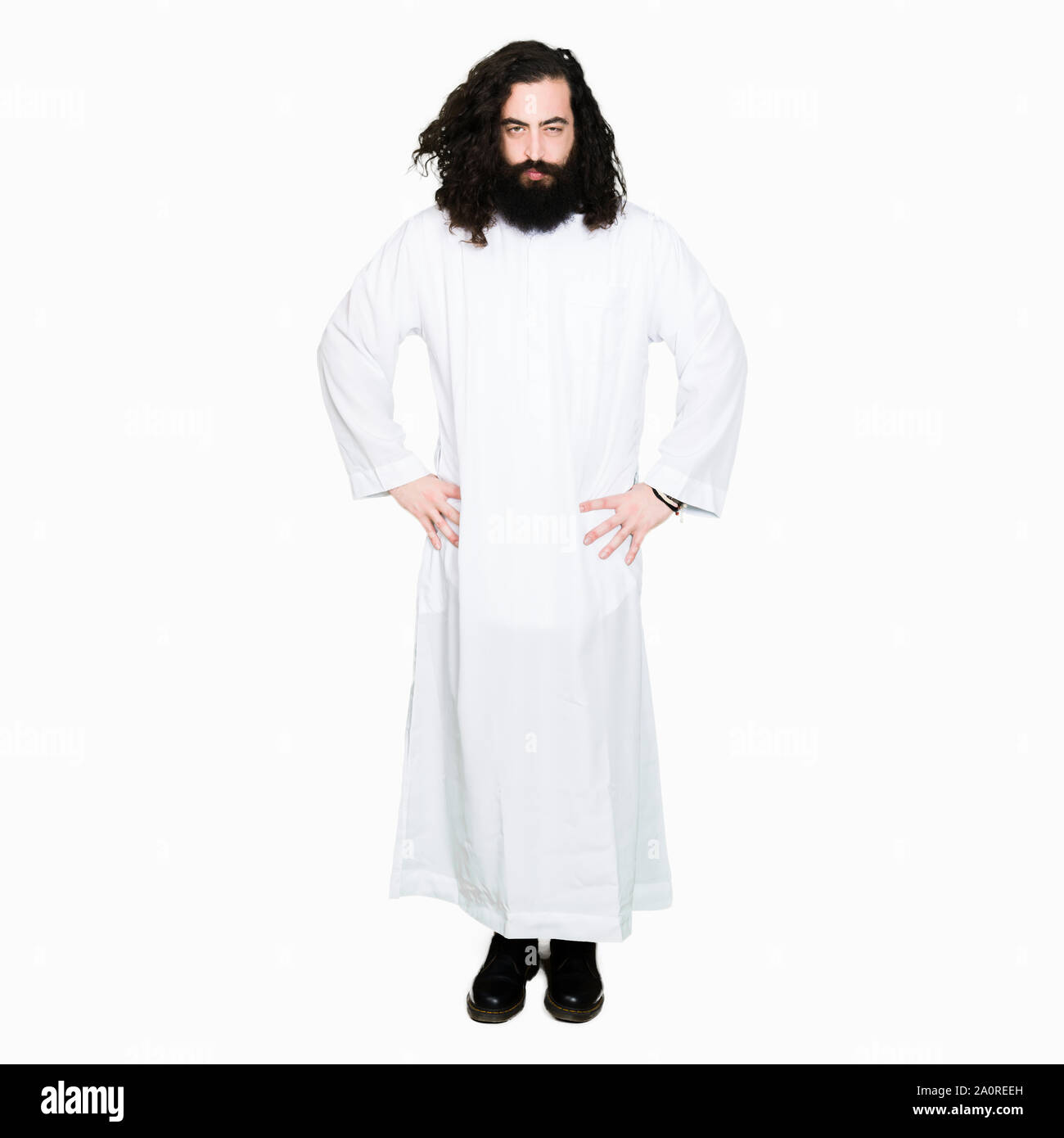 Man wearing Jesus Christ costume skeptic and nervous, frowning upset ...