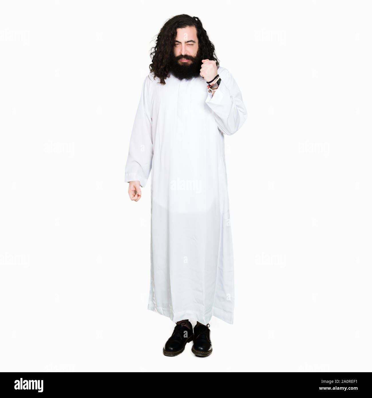 Man wearing Jesus Christ costume angry and mad raising fist frustrated ...