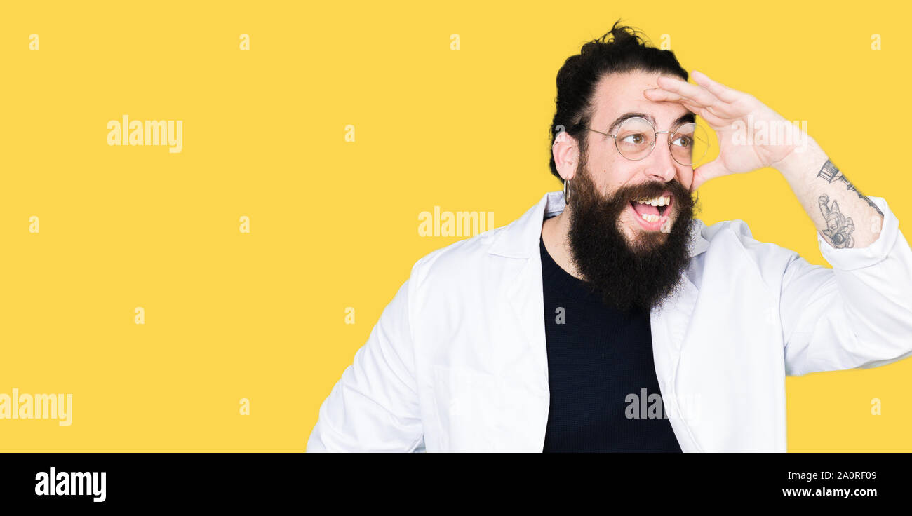 Doctor therapist man with long hair and bear wearing white coat very ...