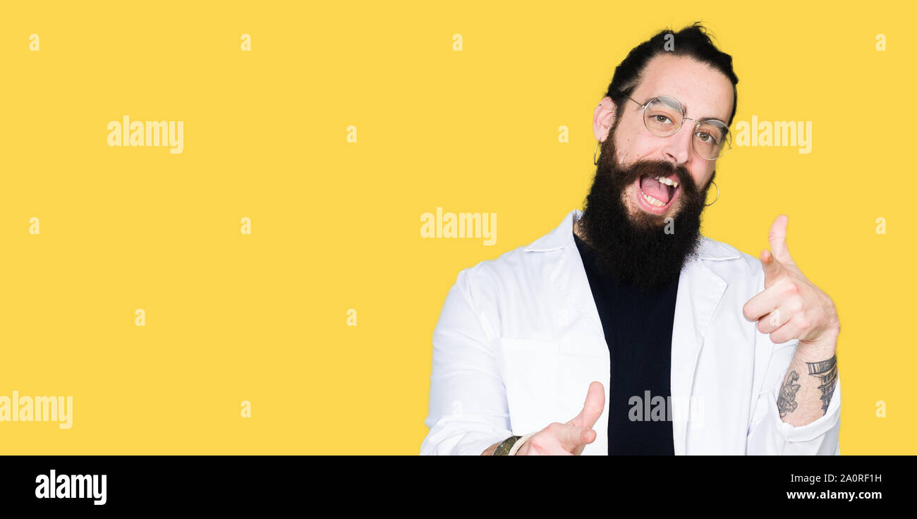 Doctor therapist man with long hair and bear wearing white coat ...