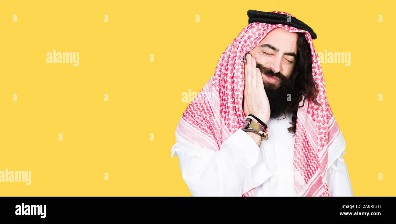 Arabian business man with long hair wearing traditional keffiyeh scarf ...