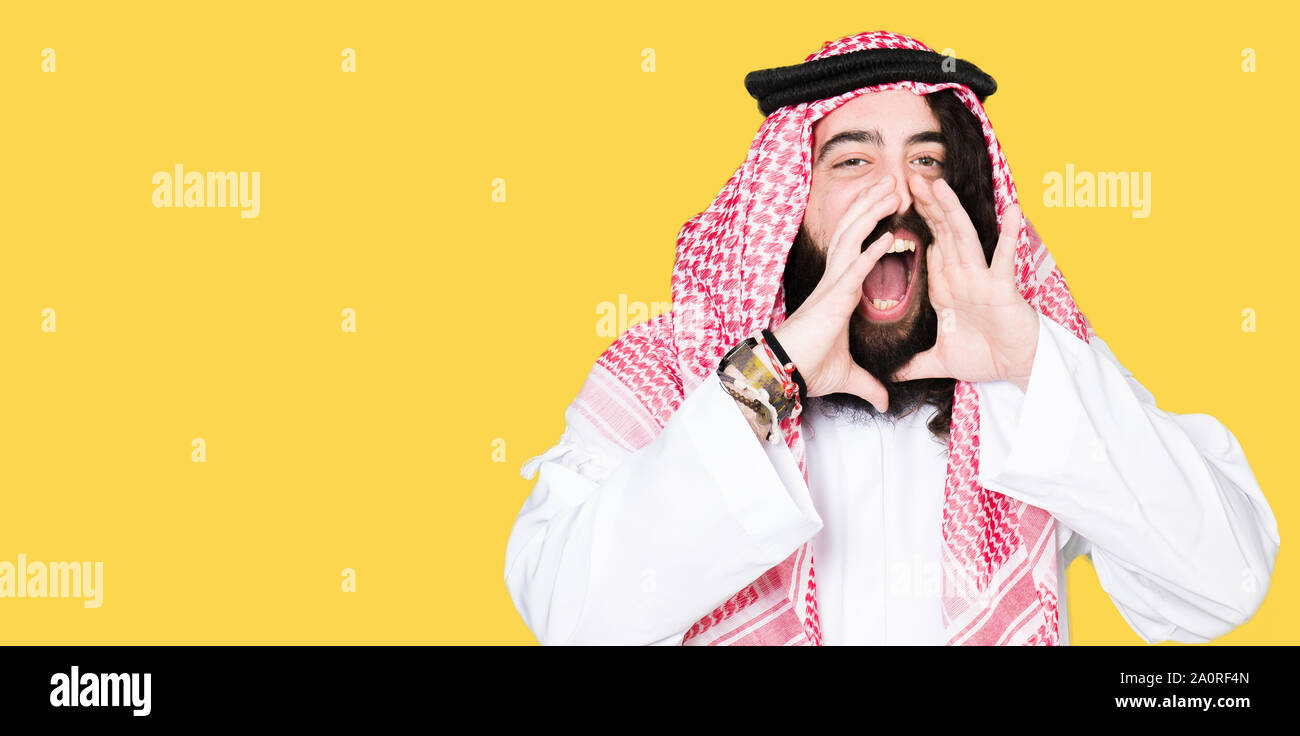 Arabian business man with long hair wearing traditional keffiyeh scarf ...