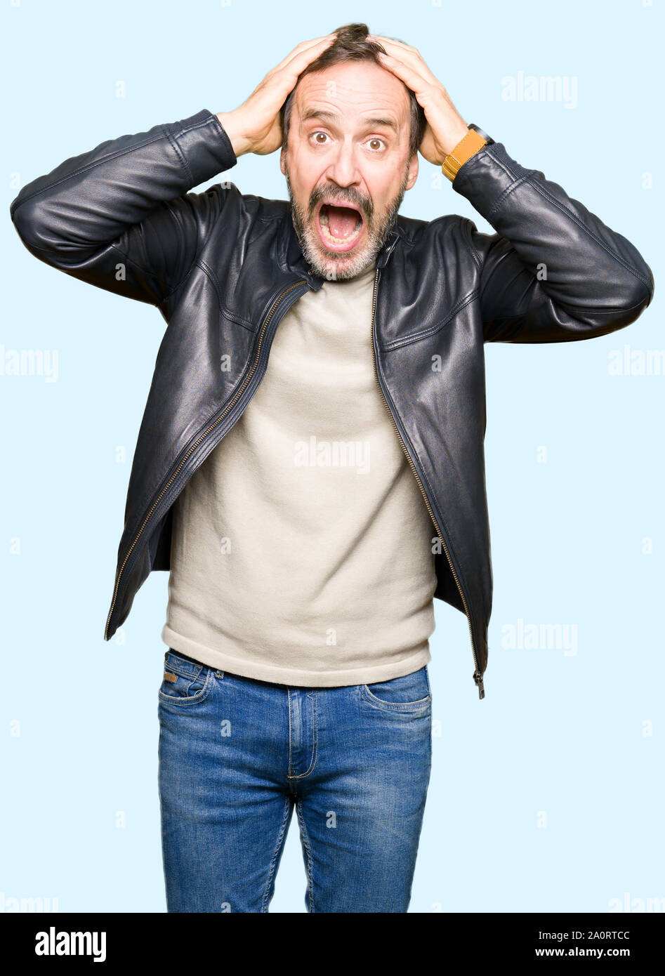Middle age handsome man wearing black leather jacket Crazy and scared ...