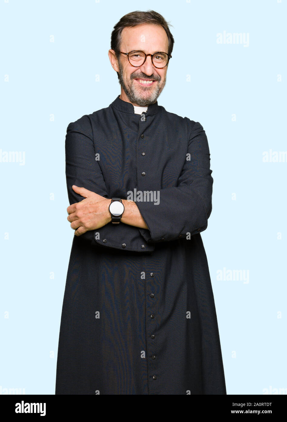 Middle age priest man wearing catholic robe happy face smiling with ...