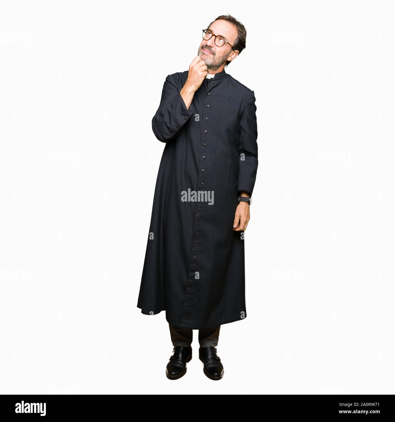 Priest looking up isolated Cut Out Stock Images & Pictures - Alamy