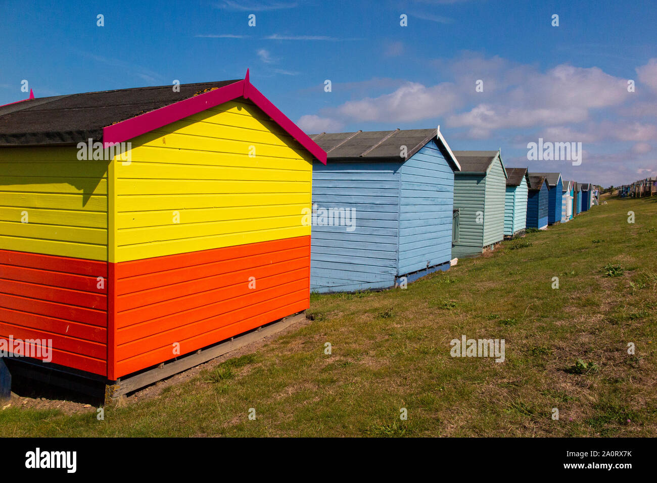 Coastal walk uk summer beach huts hi-res stock photography and images ...