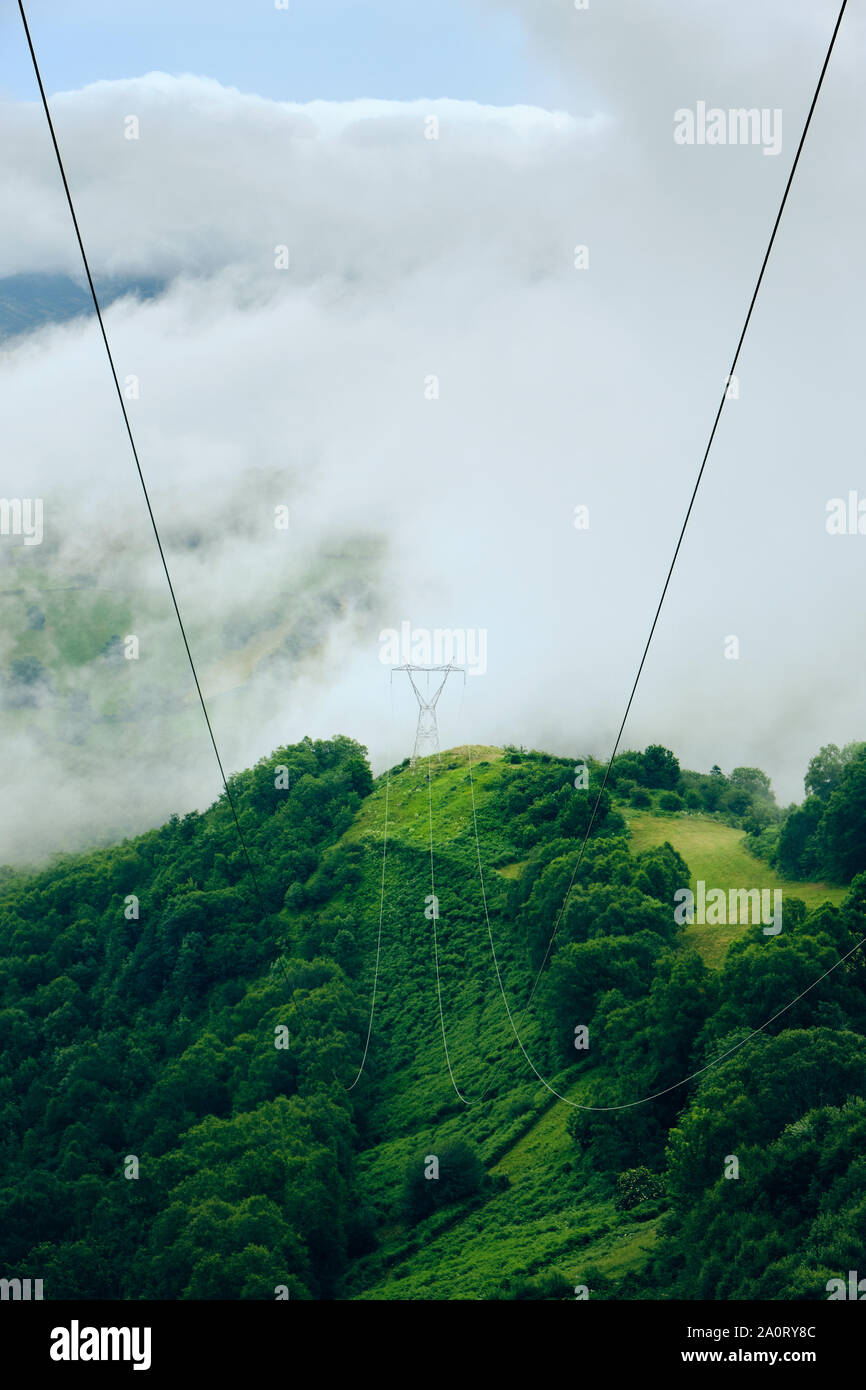 Long Distance Power Line Pylon On Peak Of Mountain With Stormy Weather ...
