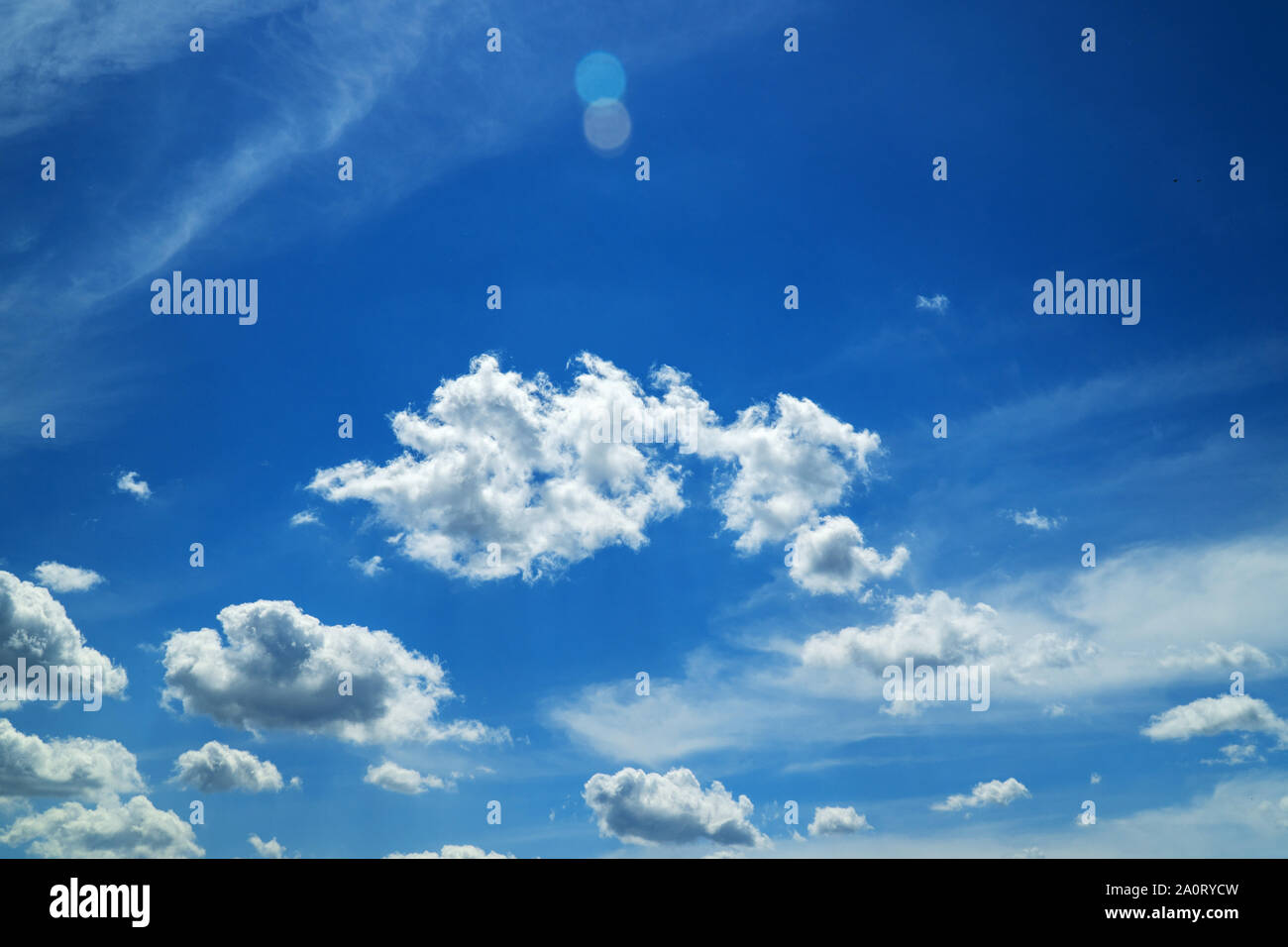 Blue sky with bright clouds background. Nature backdrop Stock Photo - Alamy