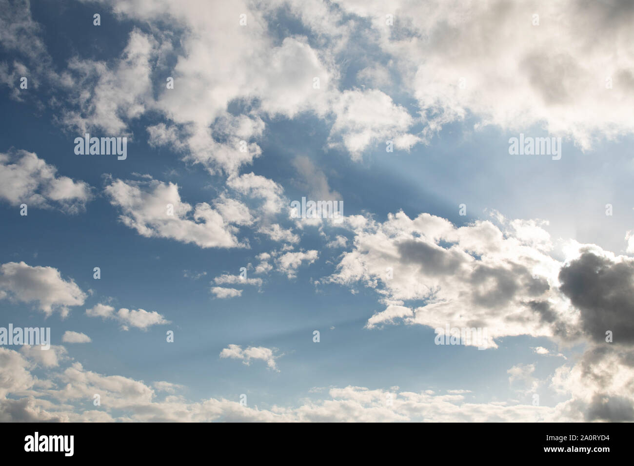 Blue sky with bright clouds background. Nature backdrop Stock Photo - Alamy