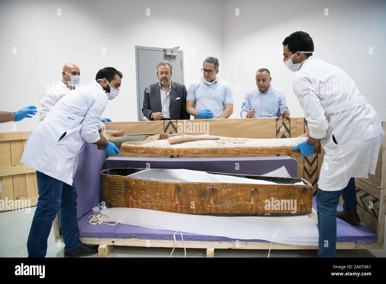 Cairo, Egypt. 21st Sep, 2019. Archaeologists unpack a sarcophagus in ...