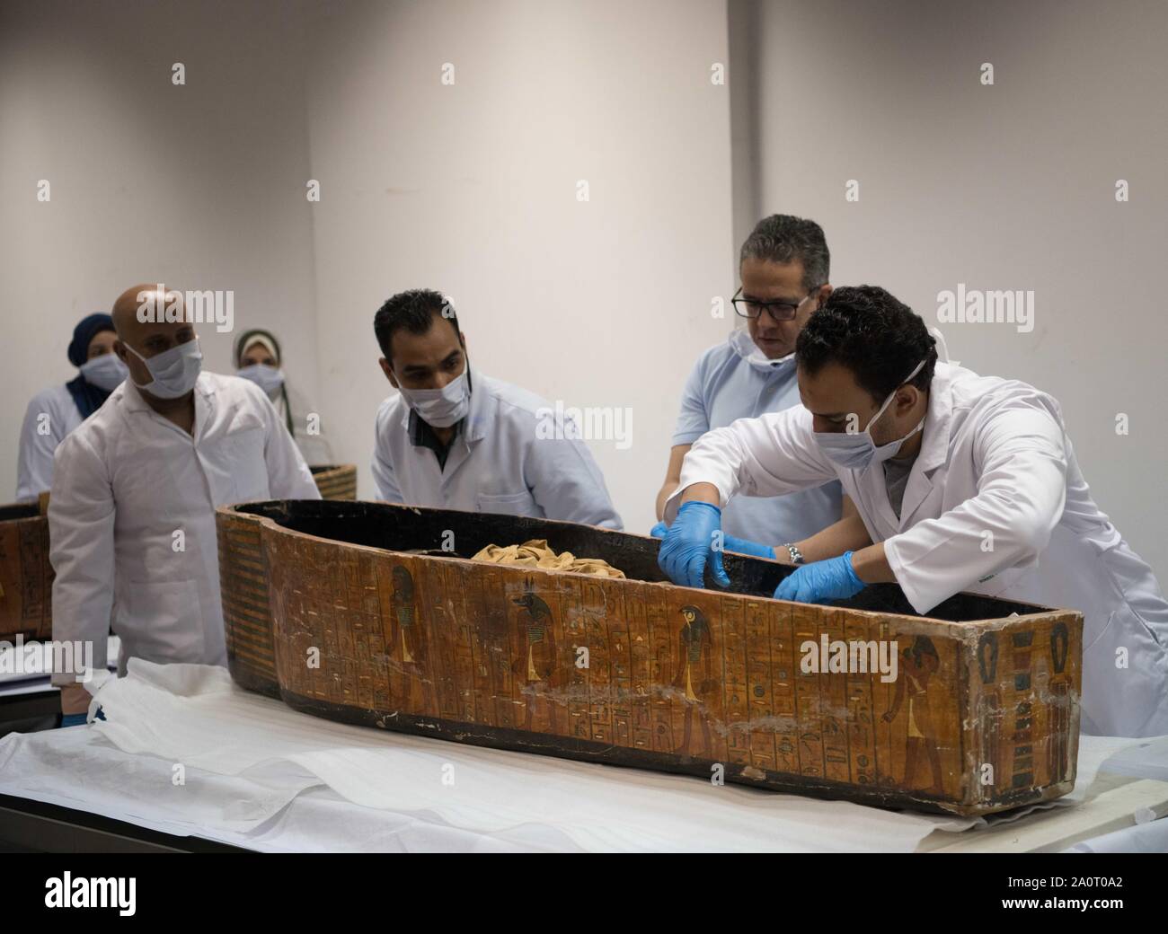 Cairo, Egypt. 21st Sep, 2019. Archaeologists work on a sarcophagus in ...
