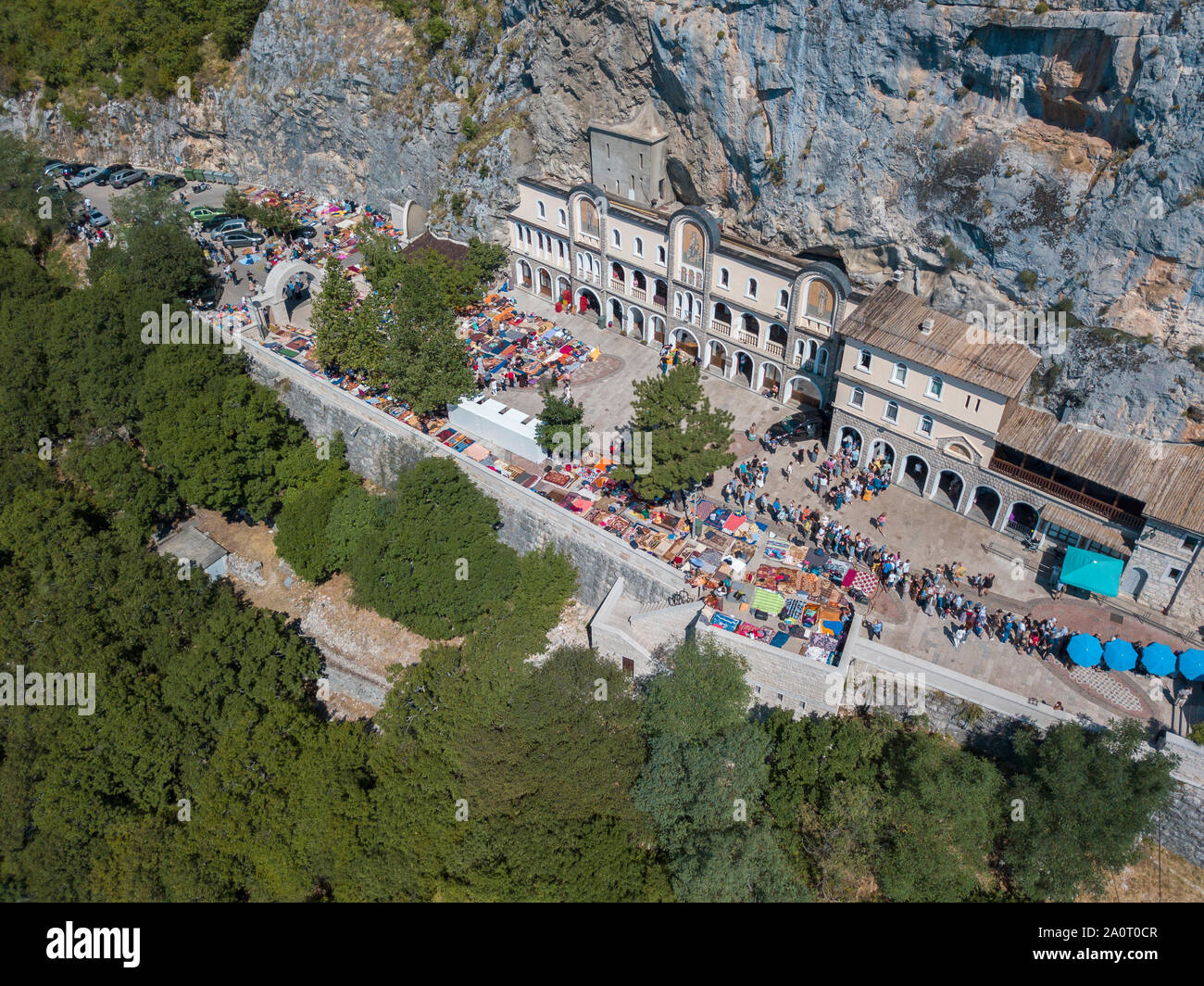 Aerial view of the monastery of Ostrog, faithful in line and pilgrims ...