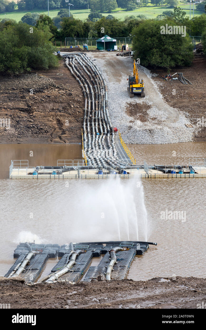 Pumping out water from Toddbrook Reservoir above Whaley Bridge in ...