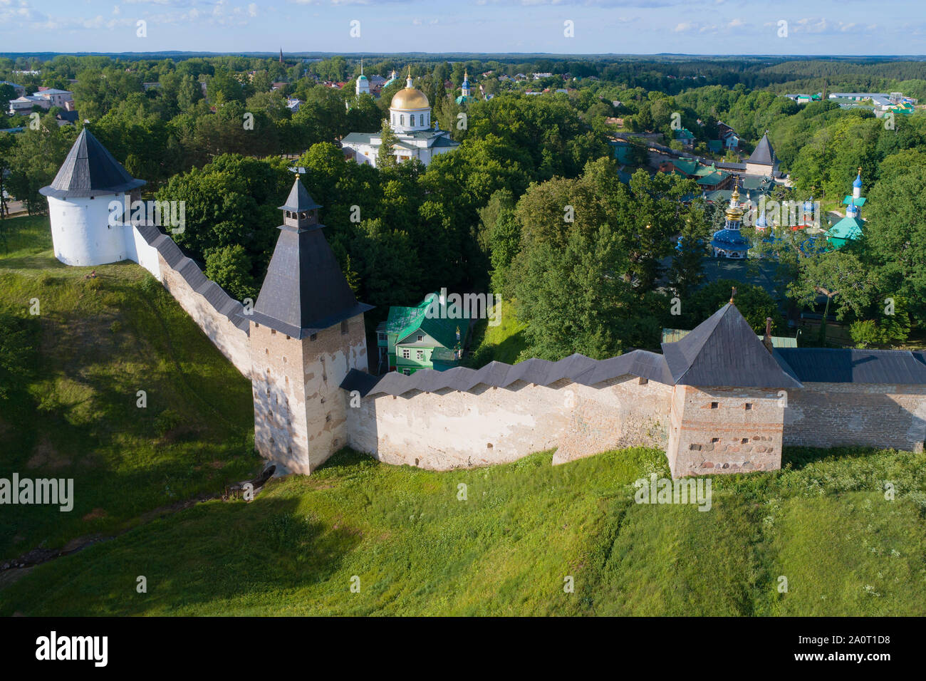 Towers of the Holy Dormition Pskovo-Pechersky Monastery on a sunny June ...