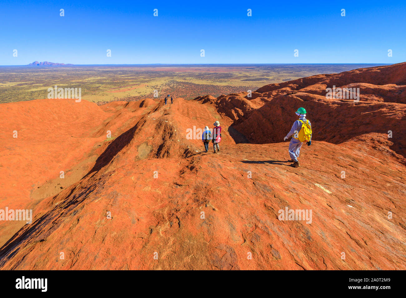 Uluru, Northern Territory, Australia - Aug 23, 2019: people descend ...