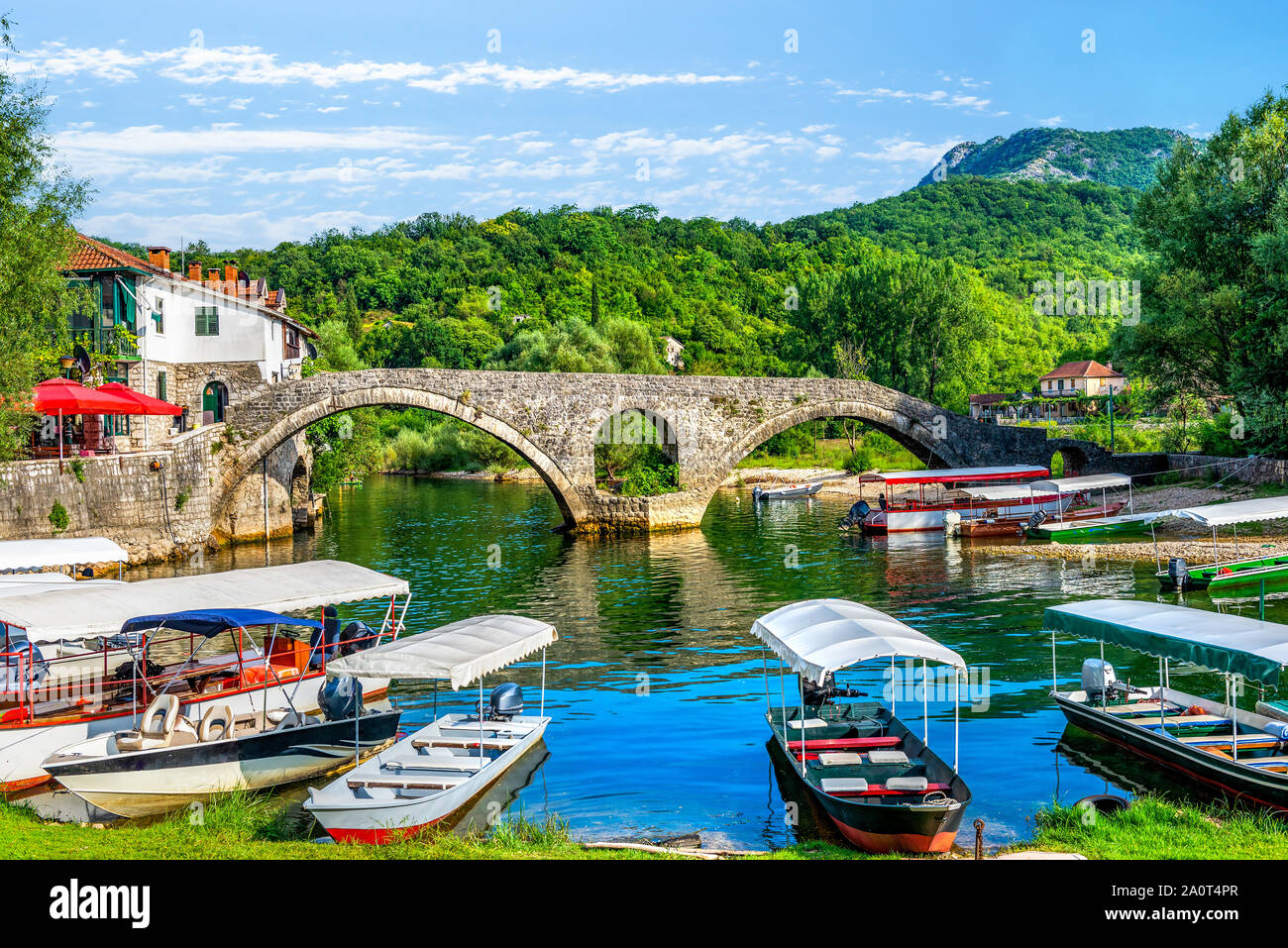 Boats near Stari Most on Crnojevica river in Montenegro Stock Photo - Alamy