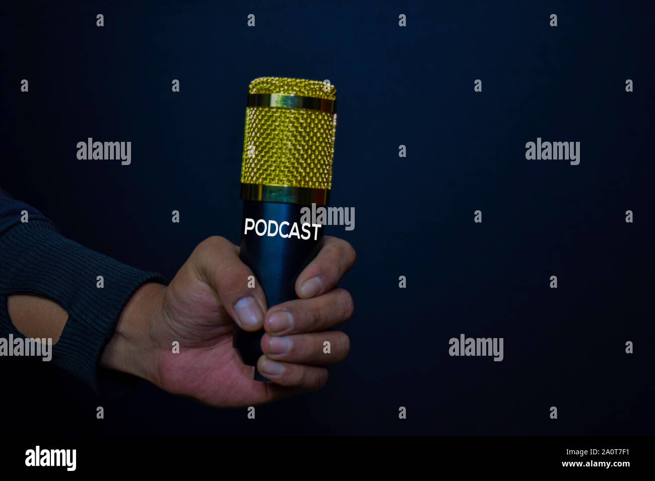 Profesional Microphone on hands isolated black background. Podcast ...