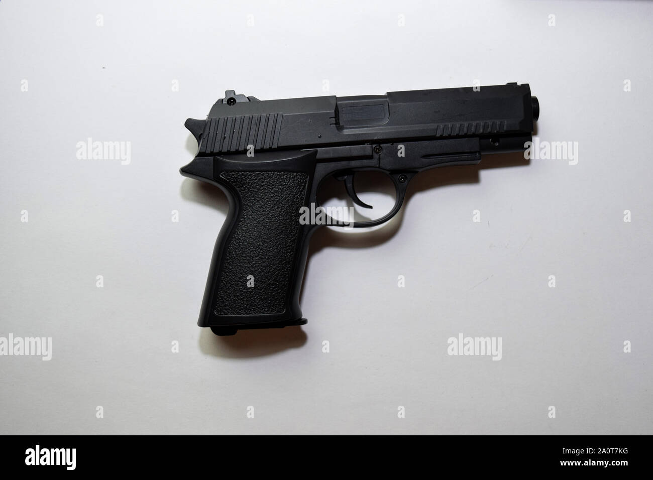 Black gun isolated on white background Stock Photo - Alamy