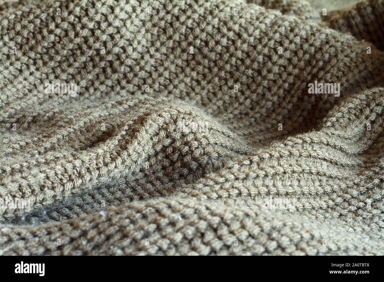 Close up olive color knitted sweater made of natural wool texture, wavy ...