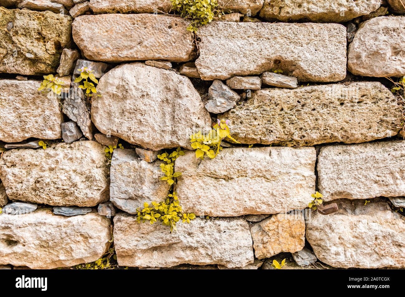 Macro shot of stone and brick wall, background Stock Photo - Alamy