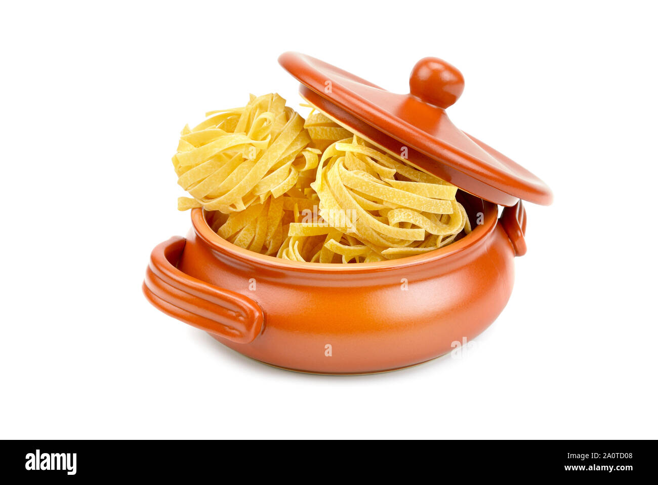 Pasta in a clay pot isolated on white background. Foods concept Stock ...
