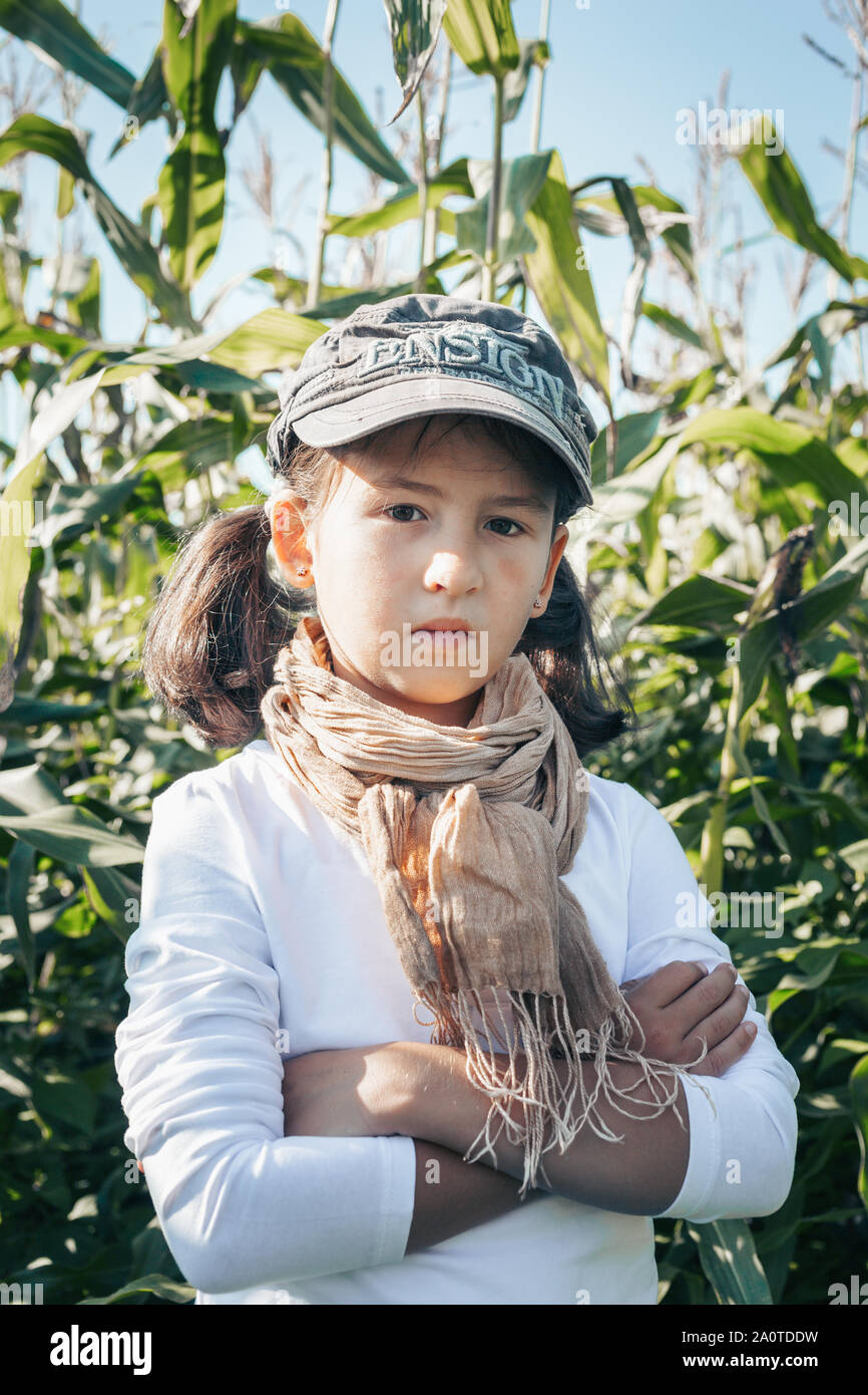 Farm girl stand in corn field. Village Life Concept. Vertical shot ...