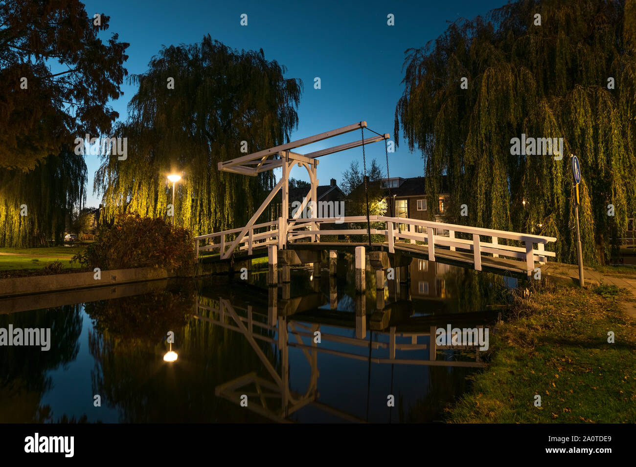 Typical dutch drawbridge during blue hour in the village of Hazerswoude ...