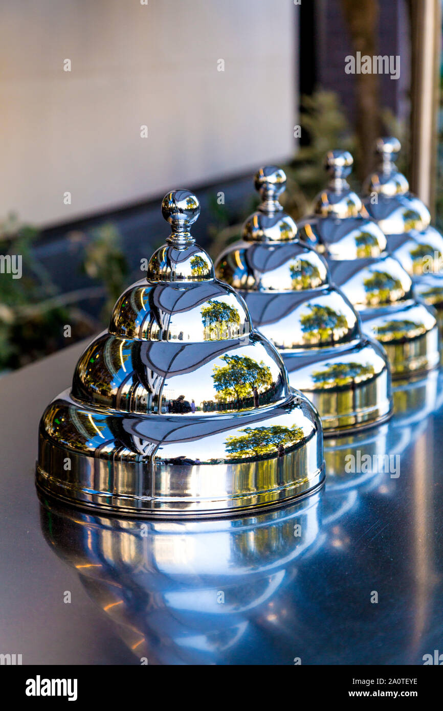Silver pyramidal dome lids for ice cream containers in an ice cream ...