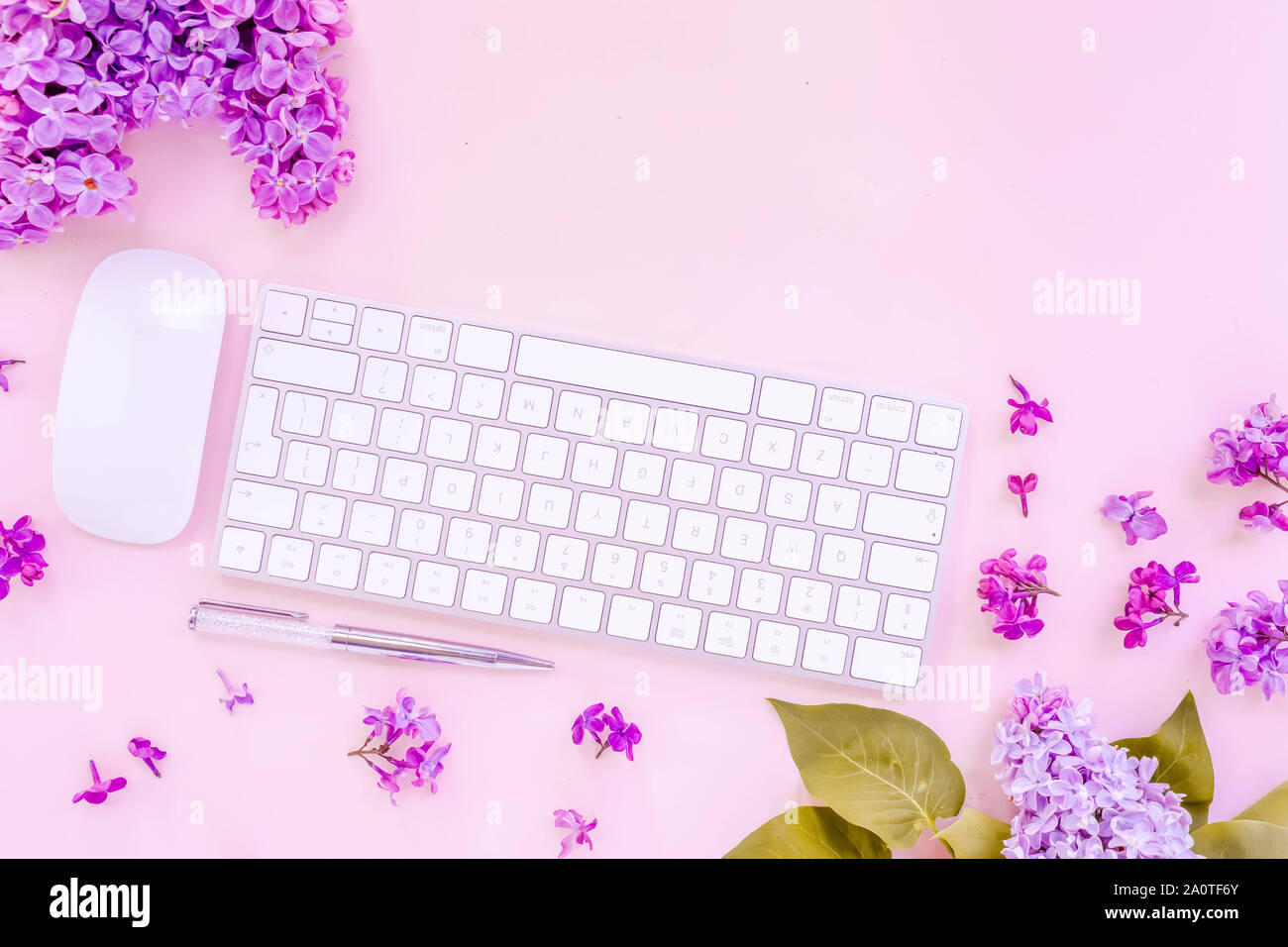 Flat lay top view home office workspace - modern keyboard with lilac ...