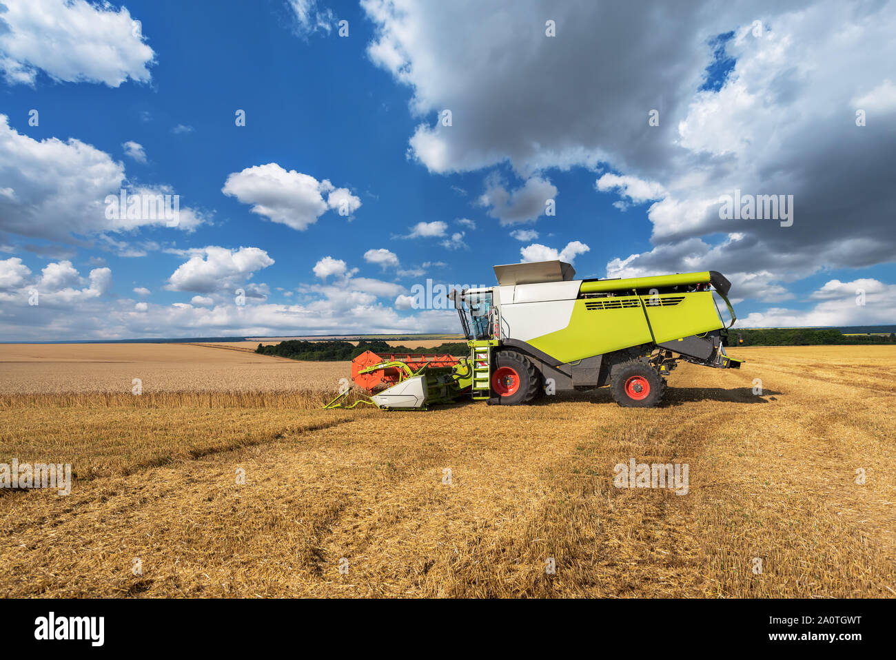 Combine harvester in action on wheat field hi-res stock photography and ...