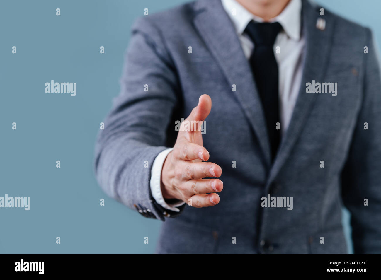 Businessman extending hand handshake hi-res stock photography and images - Alamy