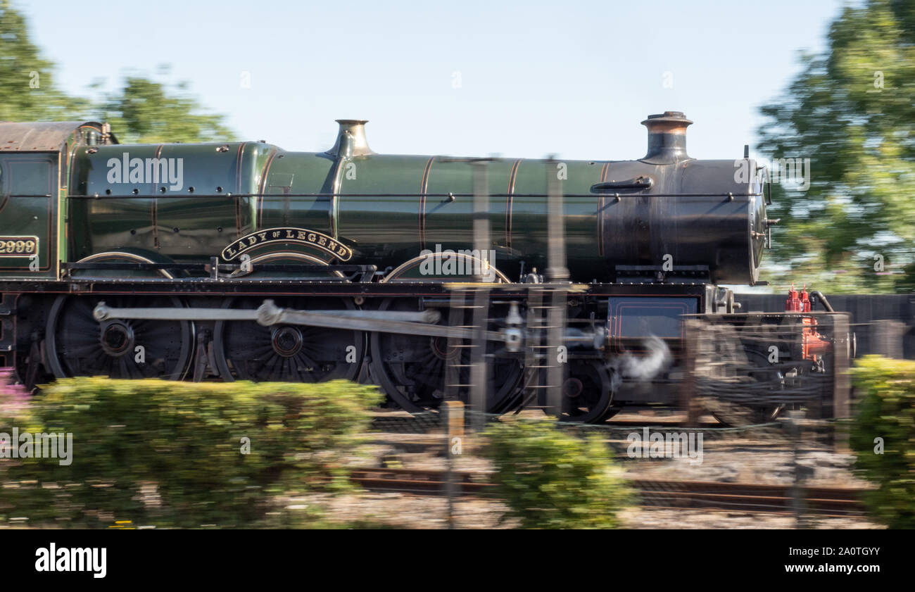 Steam train passing at speed Stock Photo - Alamy