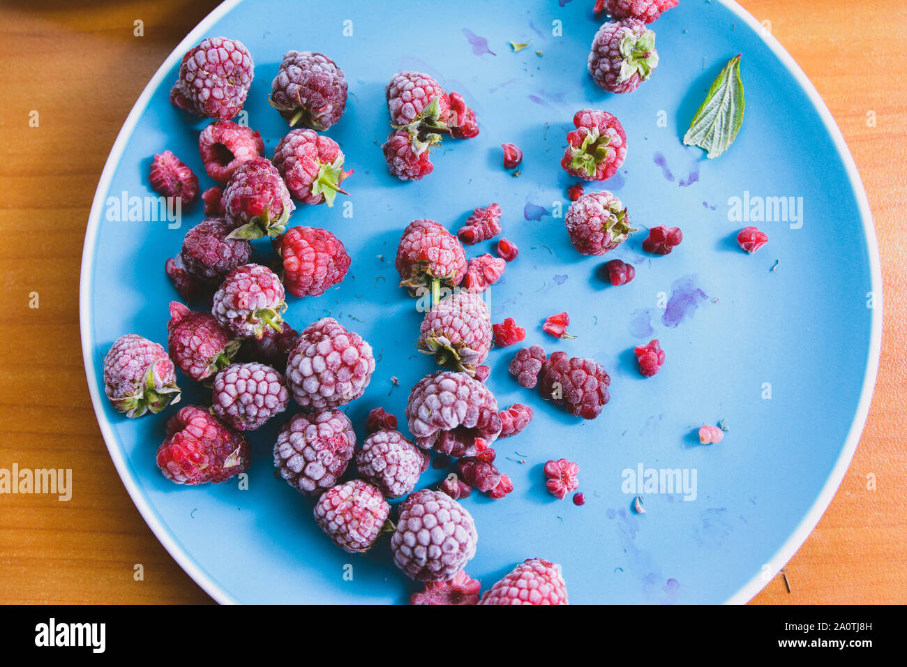 close-up raspberry berry dessert on a blue plate Stock Photo - Alamy