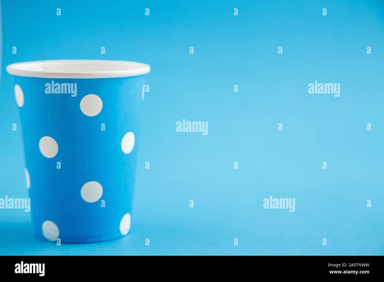 cardboard biodegradable eco-friendly cups on a blue isolated background ...
