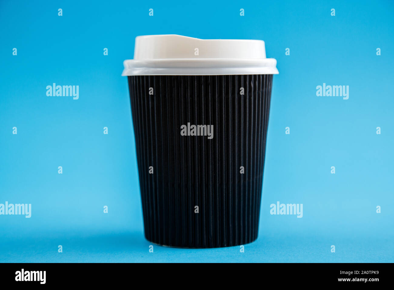 cardboard biodegradable eco-friendly cups on a blue isolated background ...