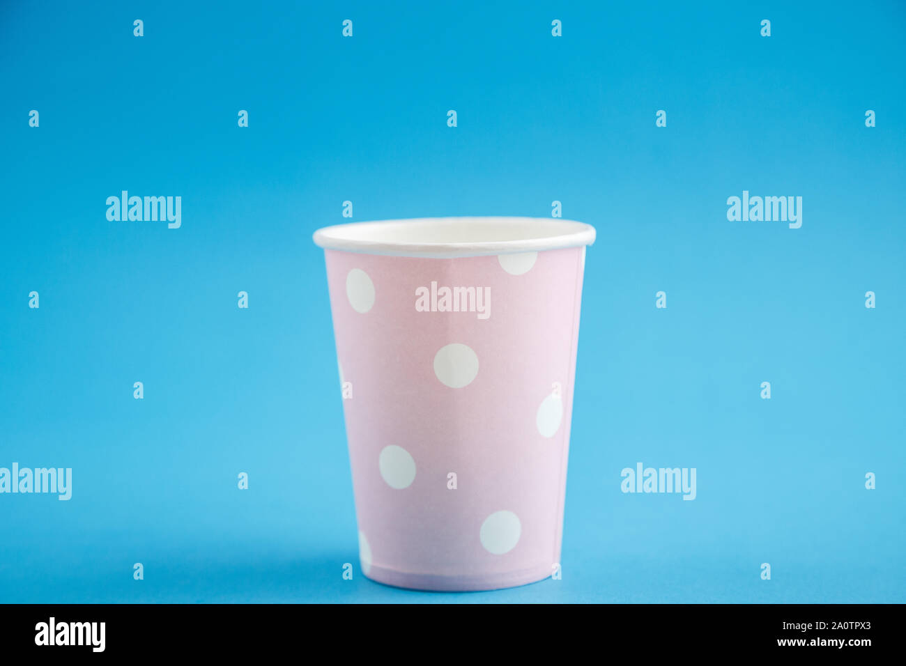 cardboard biodegradable eco-friendly cups on a blue isolated background ...